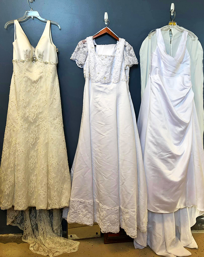 Wedding gowns waiting for second chances—because "something borrowed" is even better when it becomes "something owned."