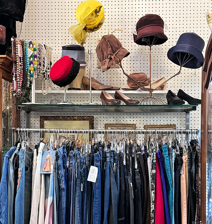 Denim heaven! Vintage jeans hang like blue soldiers in formation, with colorful hats standing guard above&mdash;a fashionista's dream of secondhand style.