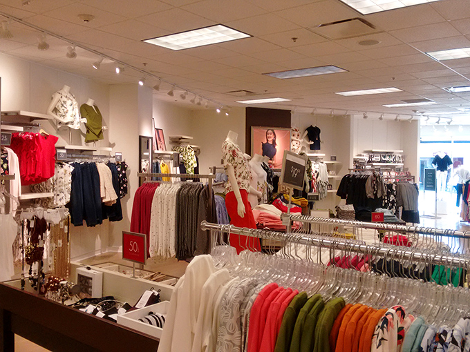 A women's clothing boutique where color-coding isn't just organizational but a visual feast that makes finding that perfect blouse feel like a treasure hunt with guaranteed success.