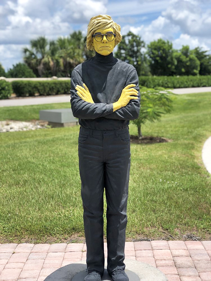 Even Andy Warhol would be impressed by this golden tribute, standing cool and collected amid Florida's tropical splendor.