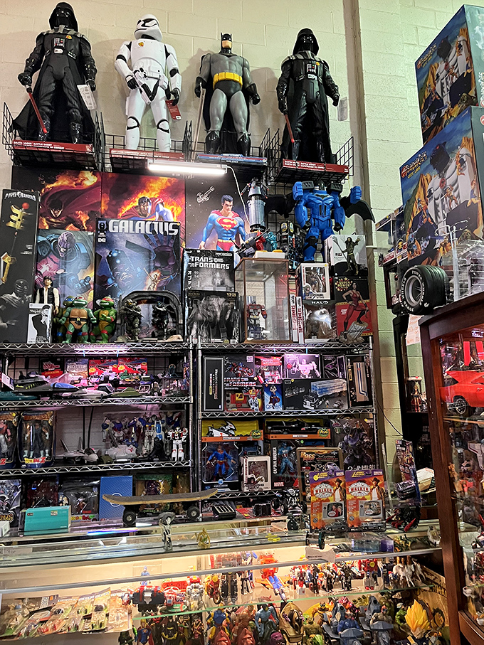 Superhero headquarters! Batman stands guard over an impressive collection of action figures that would make any collector's heart race with possibility.