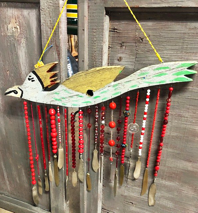 Folk art that doubles as music—this whimsical bird wind chime brings both color and gentle tinkling sounds to any garden space.