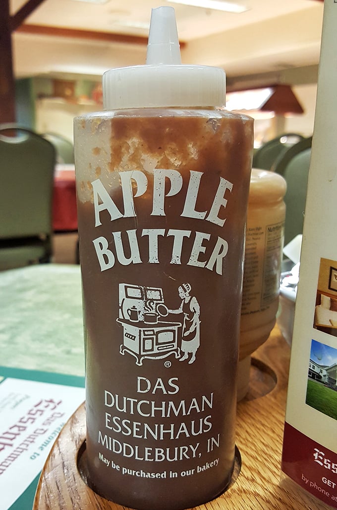 Apple butter that transforms ordinary bread into extraordinary experiences. The squeeze bottle design says "We know you'll want this on everything."