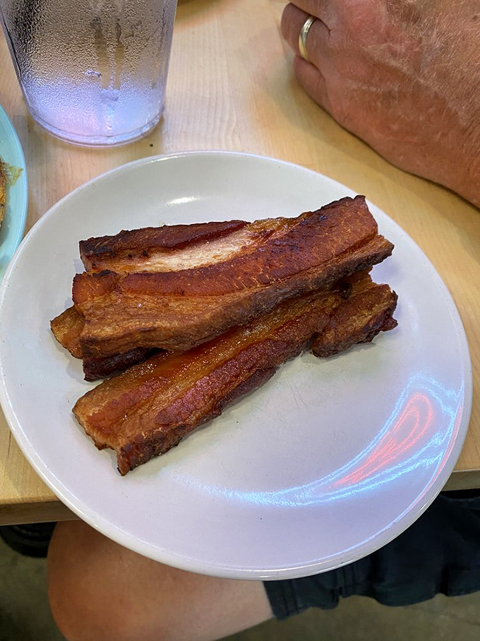 Bacon so perfectly rendered it should have its own art exhibition. Crispy, meaty, and unapologetically indulgent&mdash;breakfast's ultimate sidekick.