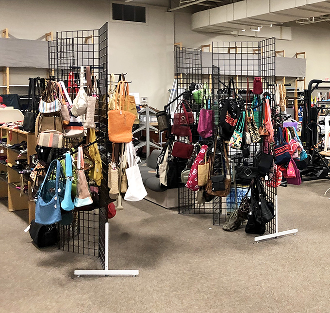 Handbag heaven! Designer purses and everyday totes hang in colorful profusion. The perfect bag is hiding here &ndash; at a fraction of retail price.