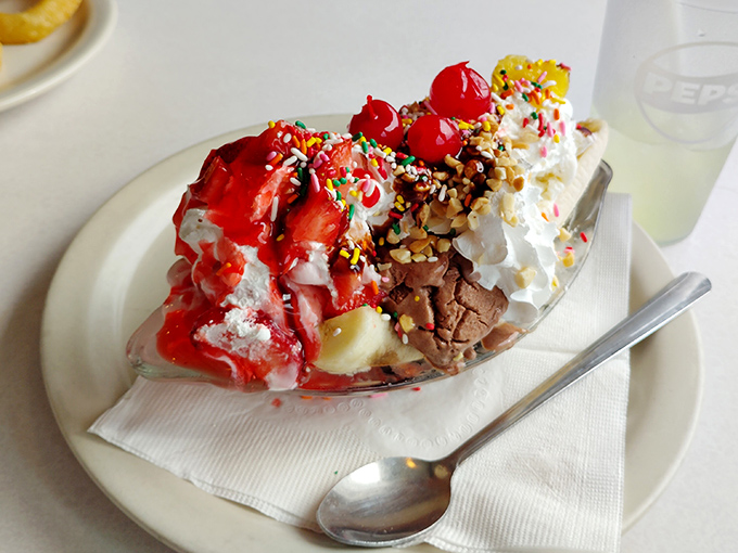 This banana split isn't just dessert&mdash;it's a carnival of flavors where cherries, sprinkles, and whipped cream compete for your attention like eager performers.