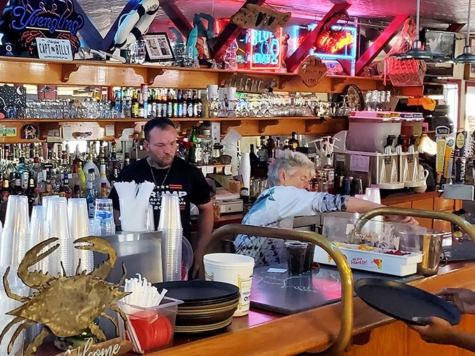 The bar at Captain Billy's &ndash; where locals and tourists unite in the universal language of "another round with these crabs, please."