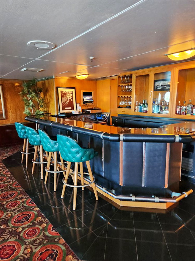 The ship's vintage cocktail bar, with its teal leather stools and polished wood, practically begs you to order something shaken, not stirred.