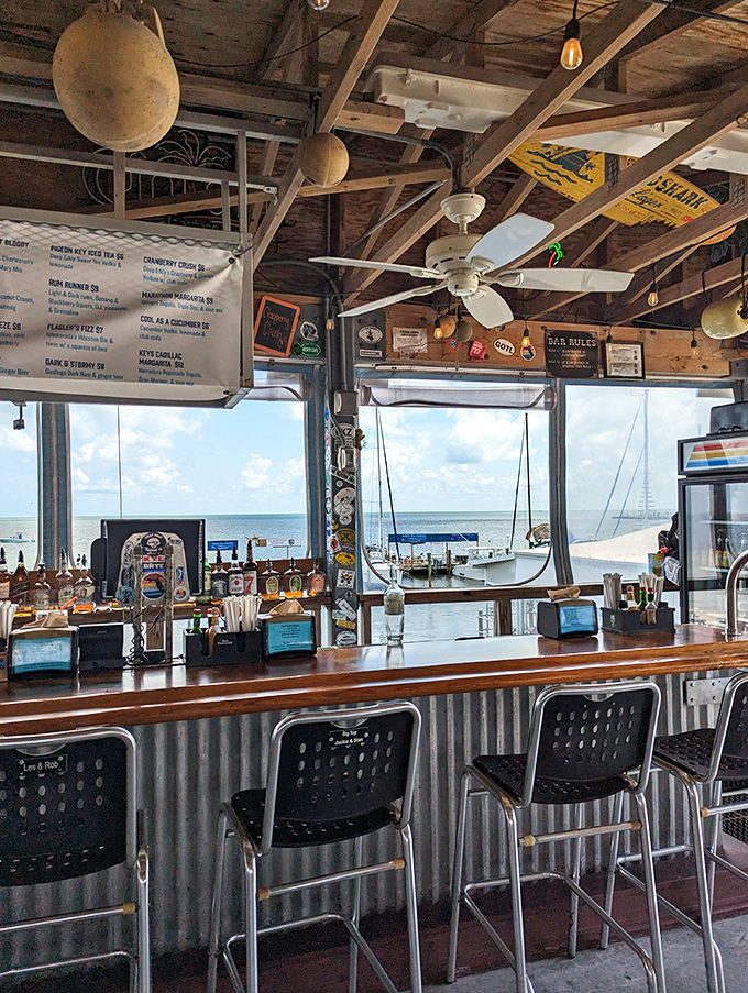 The bar offers front-row seats to boat traffic and bartender banter, where the drinks flow as steadily as the water views.