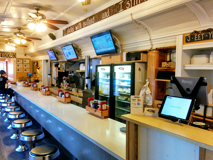 The classic counter with its row of chrome stools—where strangers become neighbors over bottomless coffee.