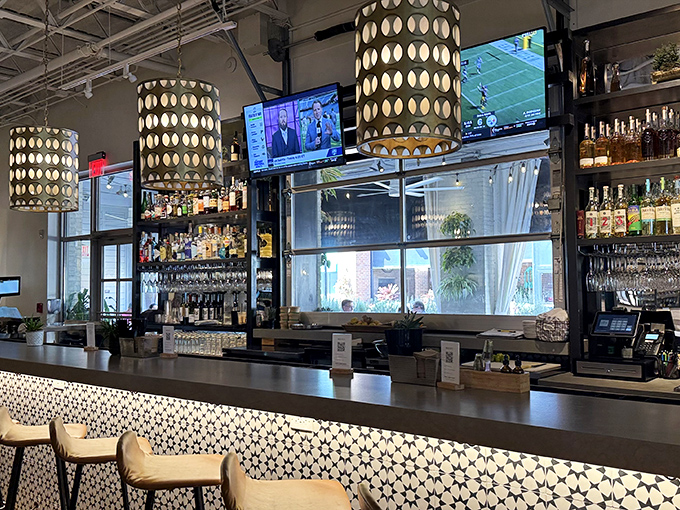 The impressive bar setup features pendant lighting that creates intimate conversation spots for every occasion.