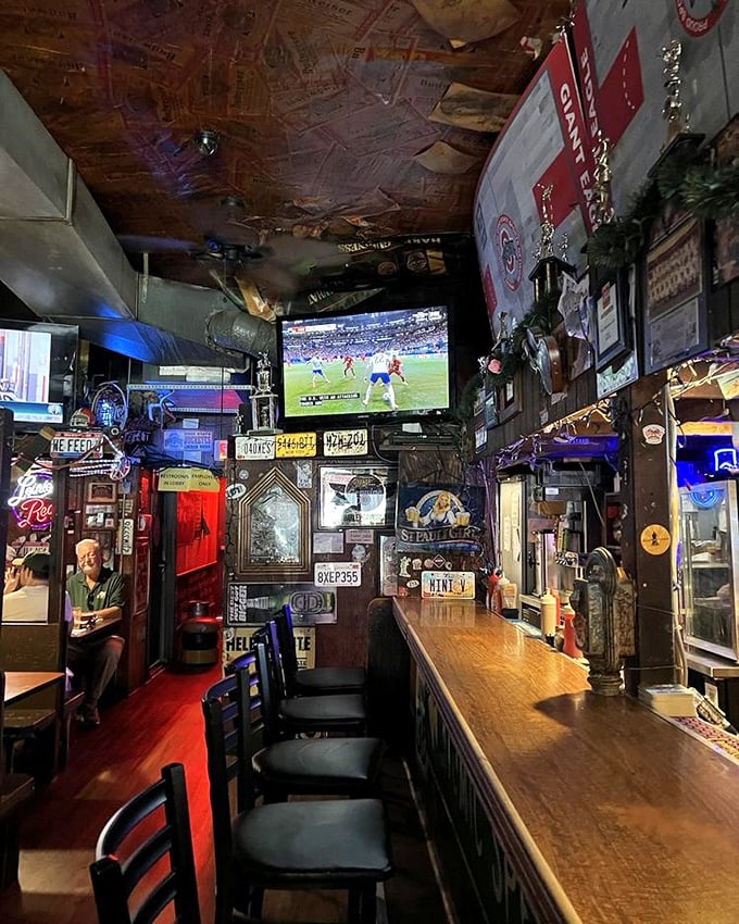 The bar's narrow corridor feels like a time capsule of good times, with every inch of wall space dedicated to memories.