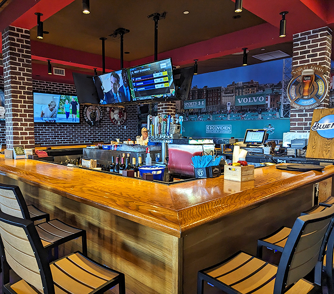 A bar that says "pull up a stool and stay awhile." The wooden countertop has probably heard more Boston sports debates than a radio call-in show.
