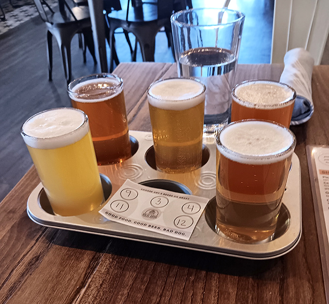 The beer flight board&mdash;where indecision becomes a virtue. Six different brews lined up like liquid soldiers ready for your tasting adventure.