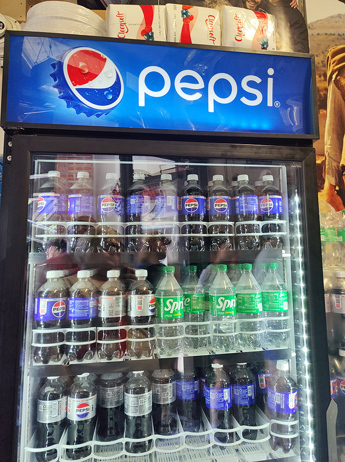 Every great sandwich deserves a cold companion. The beverage cooler stands ready to quench the thirst that inevitably follows spicy Italian goodness.