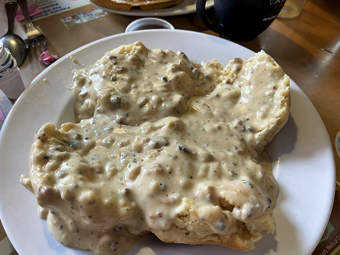 These biscuits aren't just smothered in gravy&mdash;they're embraced by it. A comfort food hug on a plate that whispers, "Everything's gonna be okay."