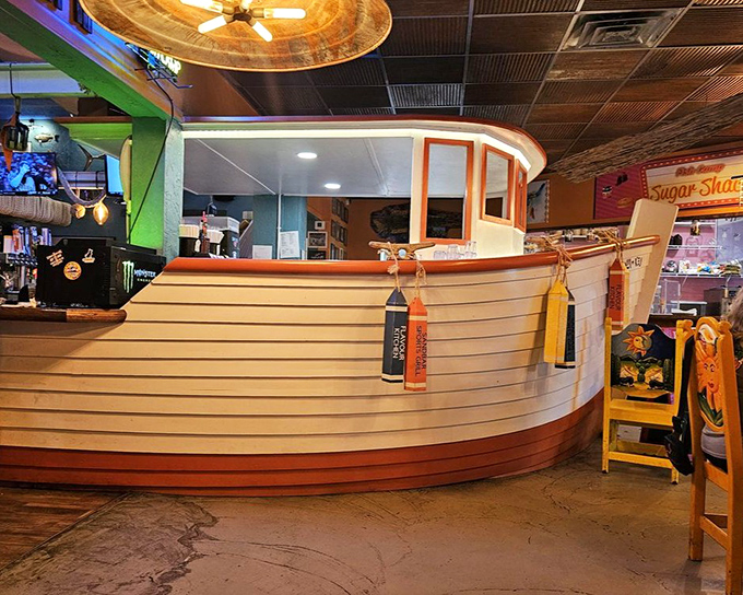 The boat-shaped bar isn't just clever design—it's where seafood stories get taller with each round. Captain-approved seating for landlubbers with good taste.