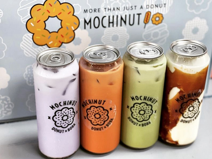 Four canned milk teas lined up like fashionable soldiers, each flavor more photogenic than the last.