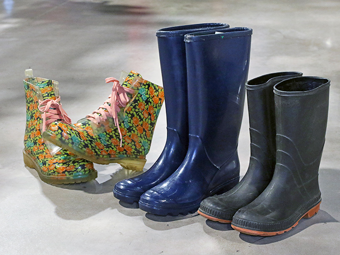 Rain boots lined up like colorful soldiers &ndash; practical armor against Pennsylvania's notorious puddles, with one pair rebelliously sporting flowers.
