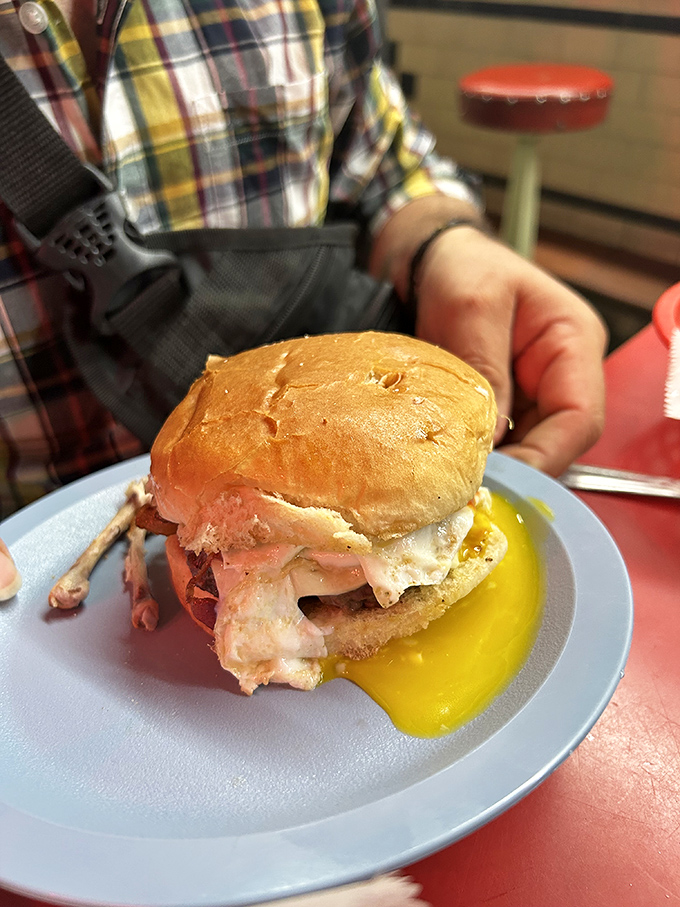 The breakfast sandwich that breaks all the rules &ndash; egg yolk cascading down the side, meat and cheese in perfect harmony, served on a bun that means business.