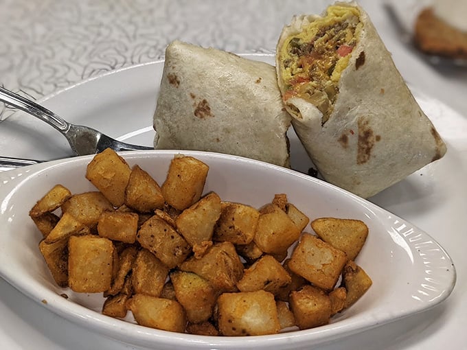 Breakfast wrapped in a tortilla hug, with home fries that have achieved that mythical balance of crispy exterior and fluffy interior.