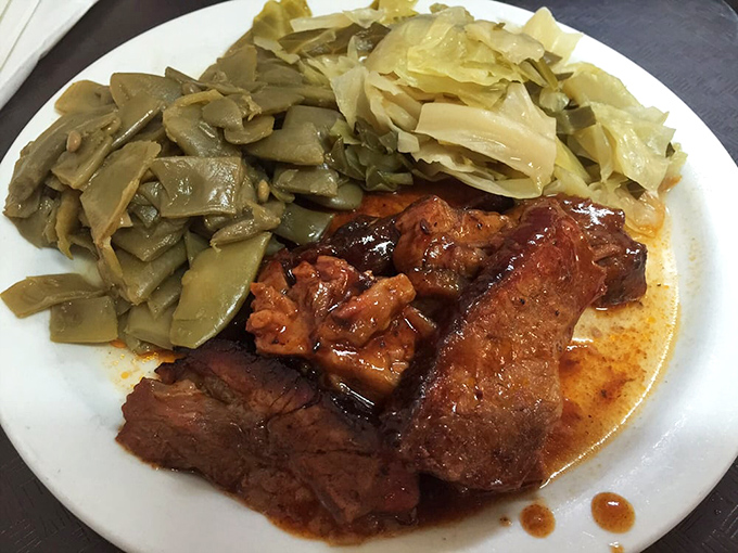 Tender brisket swimming in its own juices, with cabbage and green beans that have clearly been simmering since dawn.