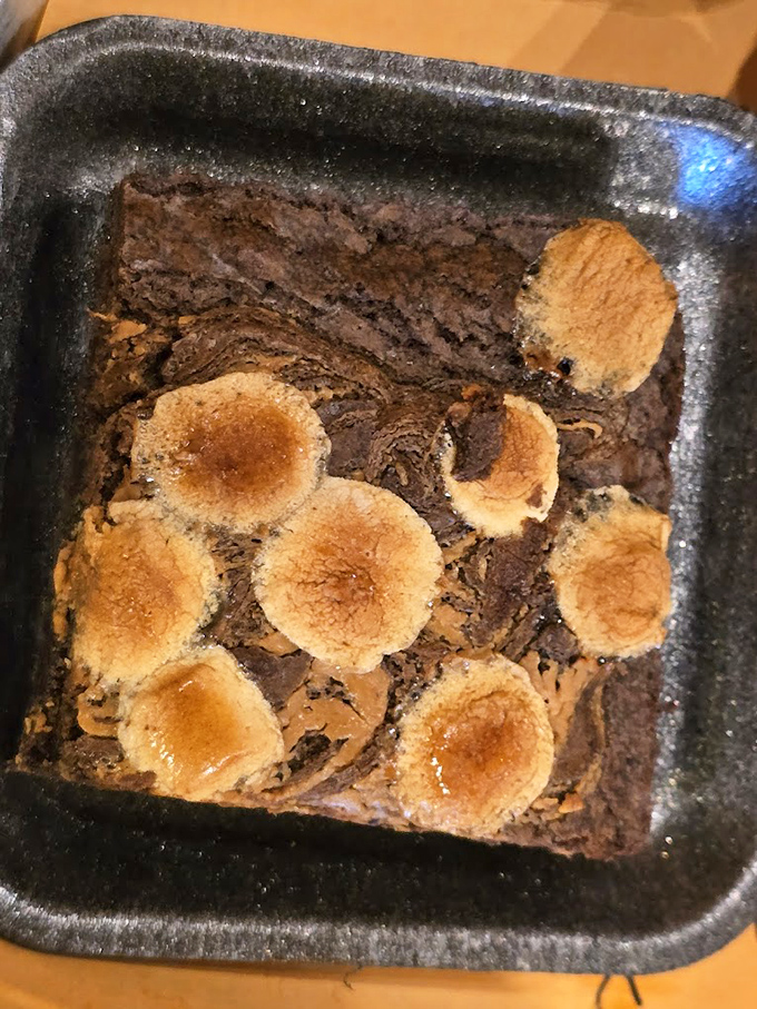 The Campfire Brownie isn't just dessert—it's the final act in a barbecue symphony, complete with toasted marshmallow encore that brings the house down.