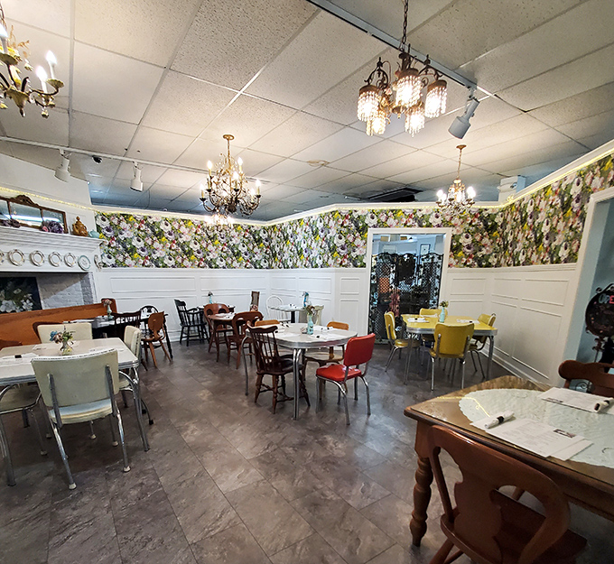 Another view of the charming cafe, where mismatched vintage chairs and decorative plates create an atmosphere that's equal parts homey and Instagram-worthy.