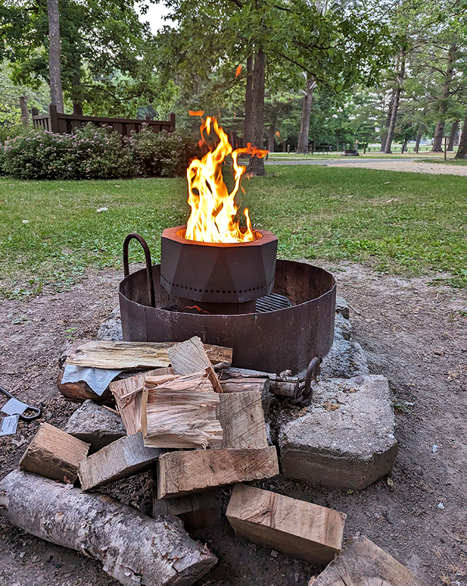 Primal television: A crackling campfire hypnotizes with its dancing flames while the scent of toasting marshmallows fills the evening air.