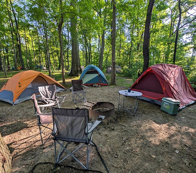 The perfect campsite equation: three colorful tents + one fire ring = stories and s'mores under a canopy of stars.