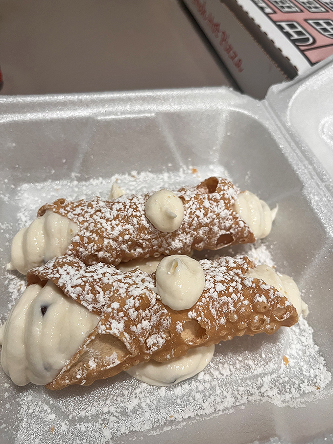 Cannoli that would make your Italian grandmother nod in approval. Crisp shells, creamy filling, and a dusting of powdered sugar&mdash;simple perfection.
