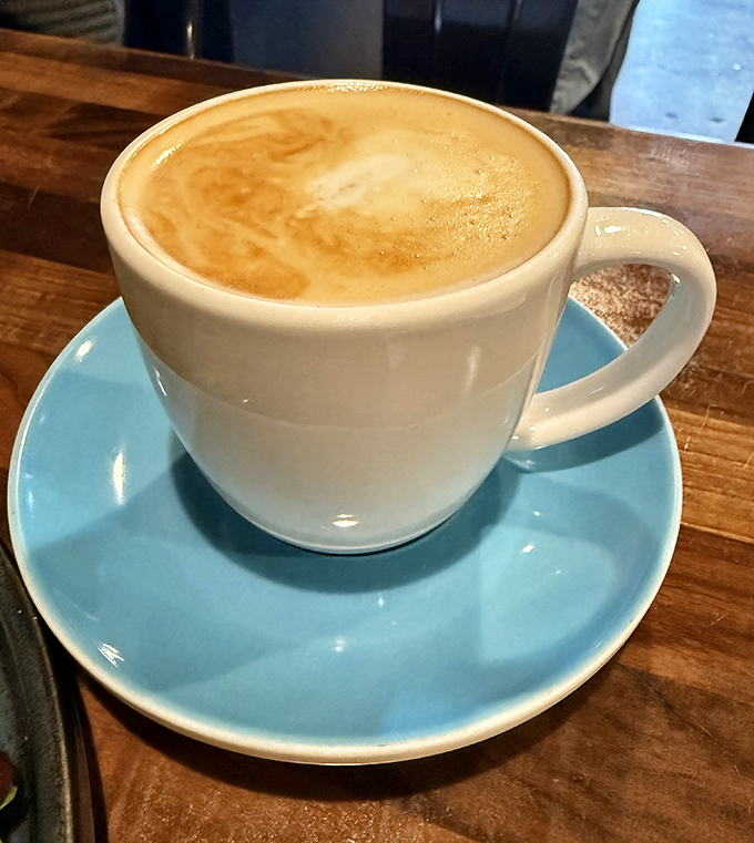 Coffee served with the respect it deserves &ndash; in a proper cup on a blue saucer with perfect foam. Morning fuel elevated to an art form.
