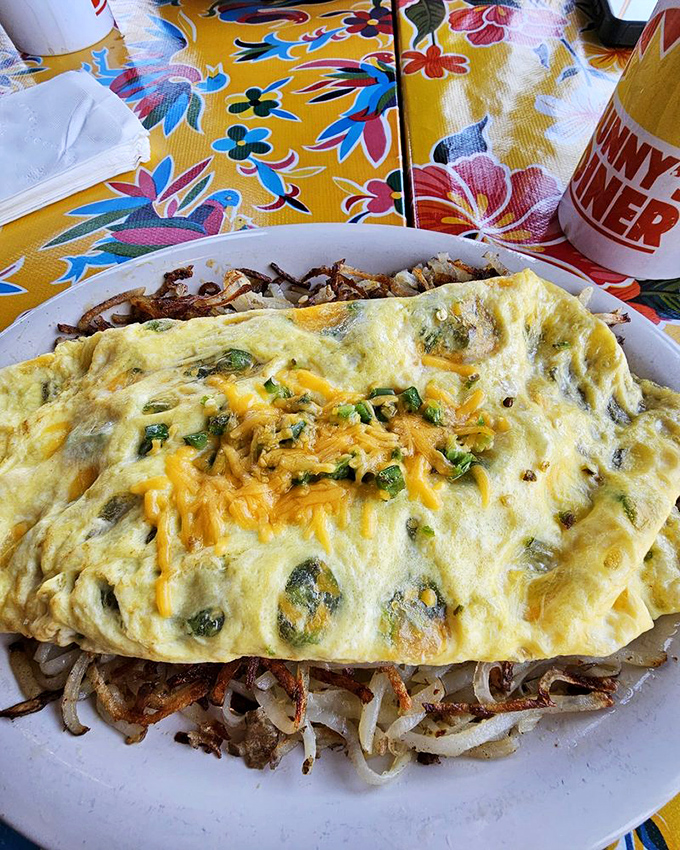 An omelet that understands cheese isn't just an ingredient but a philosophy &ndash; folded around perfectly saut&eacute;ed vegetables with hash brown bedding.