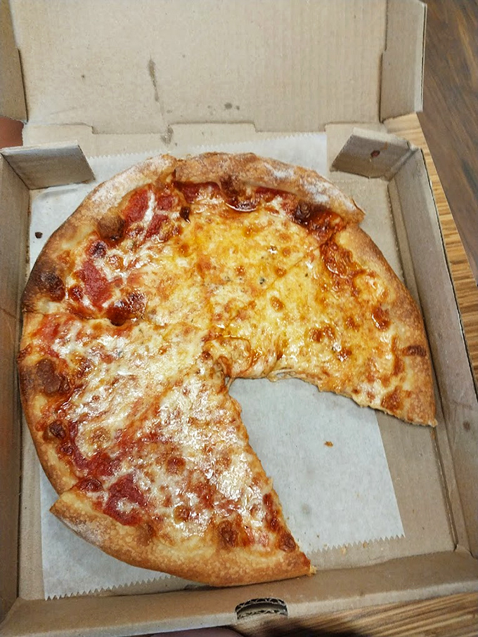 The classic cheese pizza&mdash;deceptively simple, yet the true benchmark of any pizzeria's quality. This one's passing with flying colors.