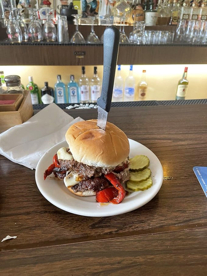 This isn't just a burger&mdash;it's architecture. Layers of beef, peppers, and cheese create a skyscraper of flavor that demands both hands and your full attention.