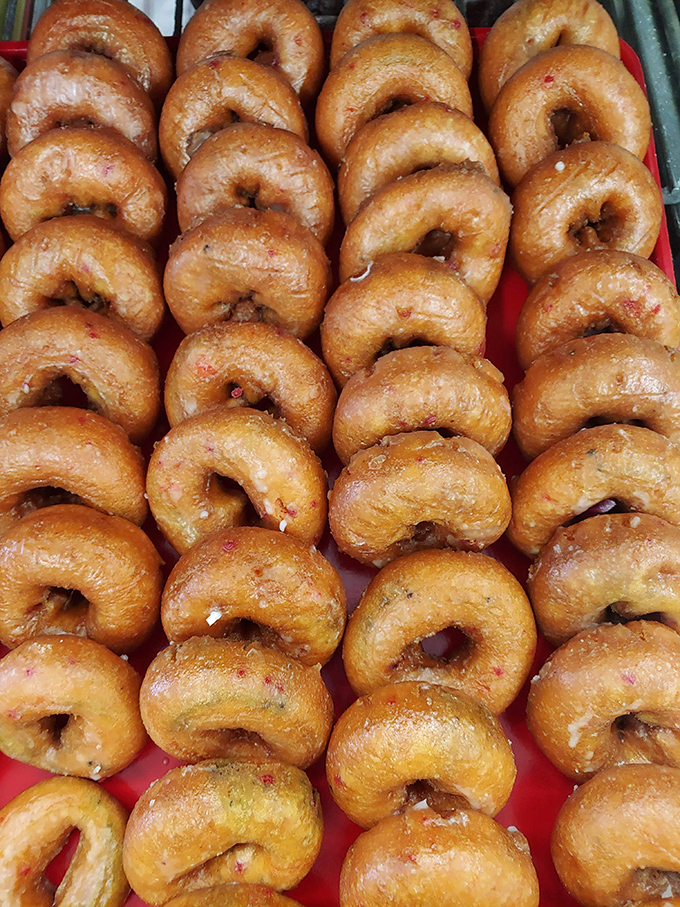 Glazed donuts standing at attention like delicious little soldiers, ready to report for breakfast duty.