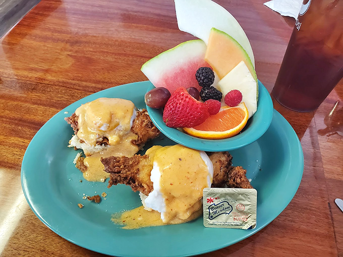 Eggs Benedict with fresh fruit &ndash; the breakfast equivalent of wearing a tuxedo with colorful socks. Classy with a playful twist.