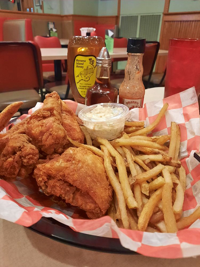 Fried chicken that would make your Southern grandmother weep with joy, served with fries so perfectly golden they deserve their own Instagram account.
