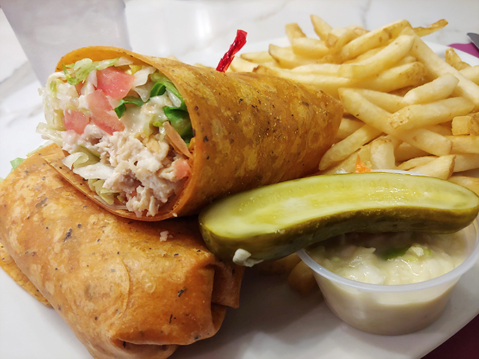 The humble wrap elevated to art form &ndash; crispy on the outside, creamy-crunchy within, and paired with fries that demand to be savored.