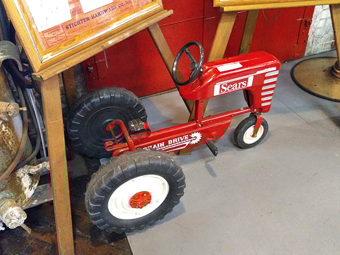 Every kid's farm fantasy in bright red metal. This Sears pedal tractor probably launched more agricultural careers than an Iowa State scholarship.
