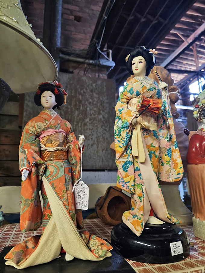 Delicate Japanese figurines stand frozen in time, their intricate kimonos and serene expressions offering a moment of zen amid the treasure hunt.