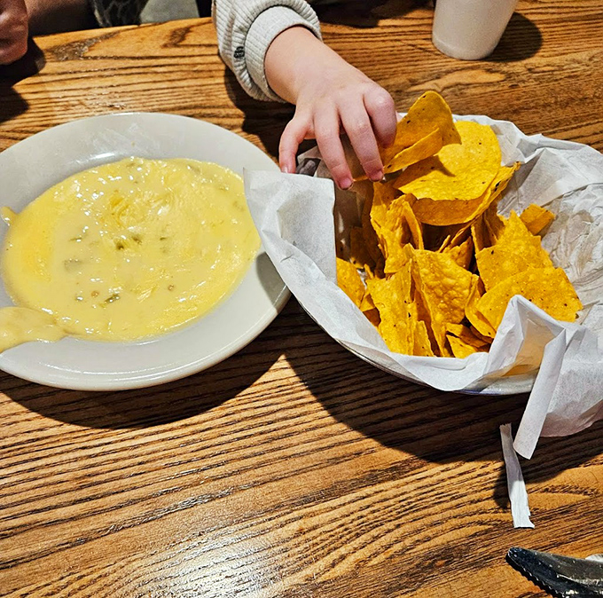 Complimentary chips and queso because even great steakhouses know how to make friends from the start.