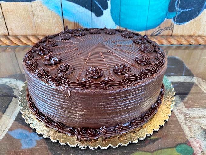 Chocolate cake so rich it probably has its own offshore bank account. The kind of dessert that demands you close your eyes with each bite.