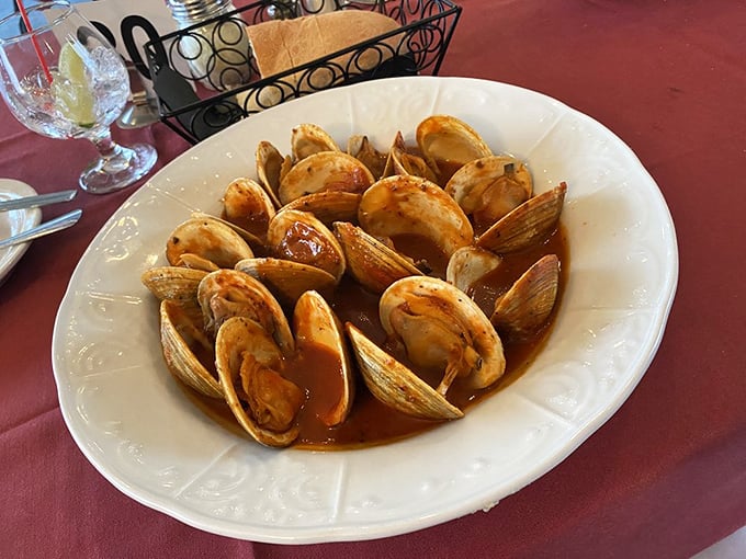 These clams aren't just swimming in sauce&mdash;they're doing the backstroke in flavor country, shells open like tiny mouths saying "eat me!"