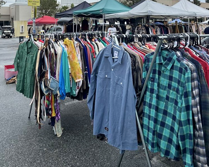 The shirt rainbow! Vintage flannels and work shirts hang like colorful flags, each representing the Republic of Secondhand Style where everyone's welcome.