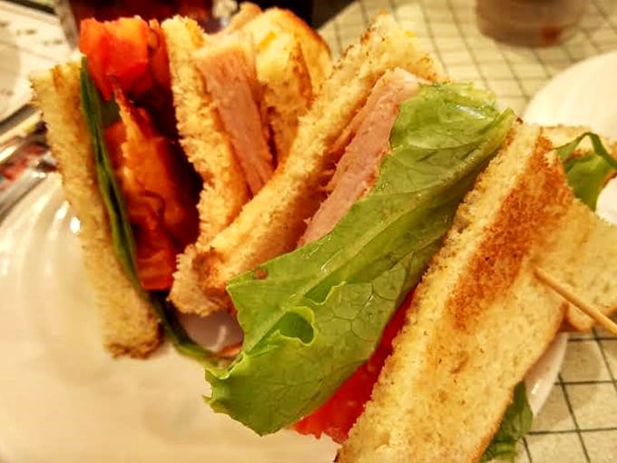 This club sandwich stands taller than some of Ohio's hills, with layers that tell a more compelling story than most bestselling novels.
