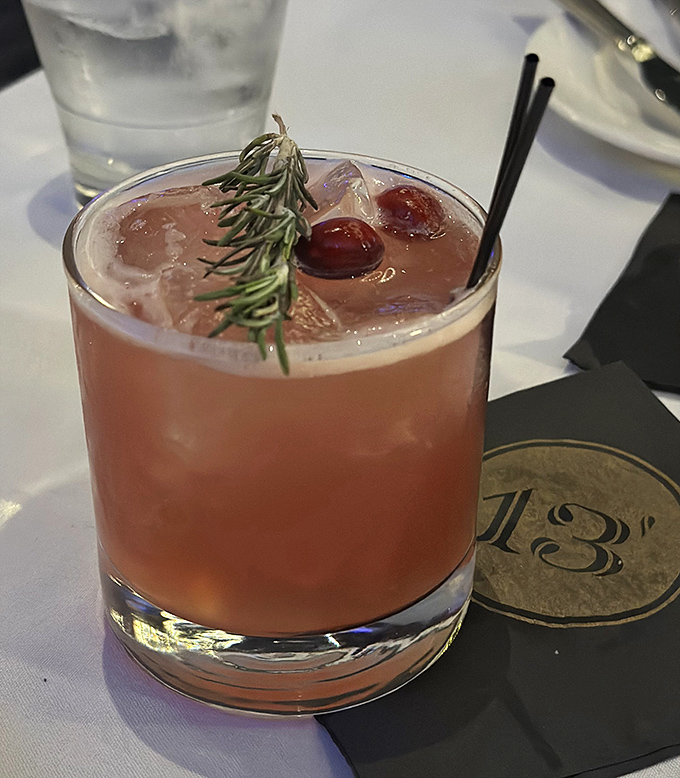 This isn't just a cocktail; it's a botanical garden in a glass, garnished with rosemary that doubles as aromatic entertainment.