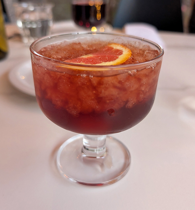 A cocktail that looks like it's wearing its Sunday best. That grapefruit slice isn't just garnish&mdash;it's making a statement.