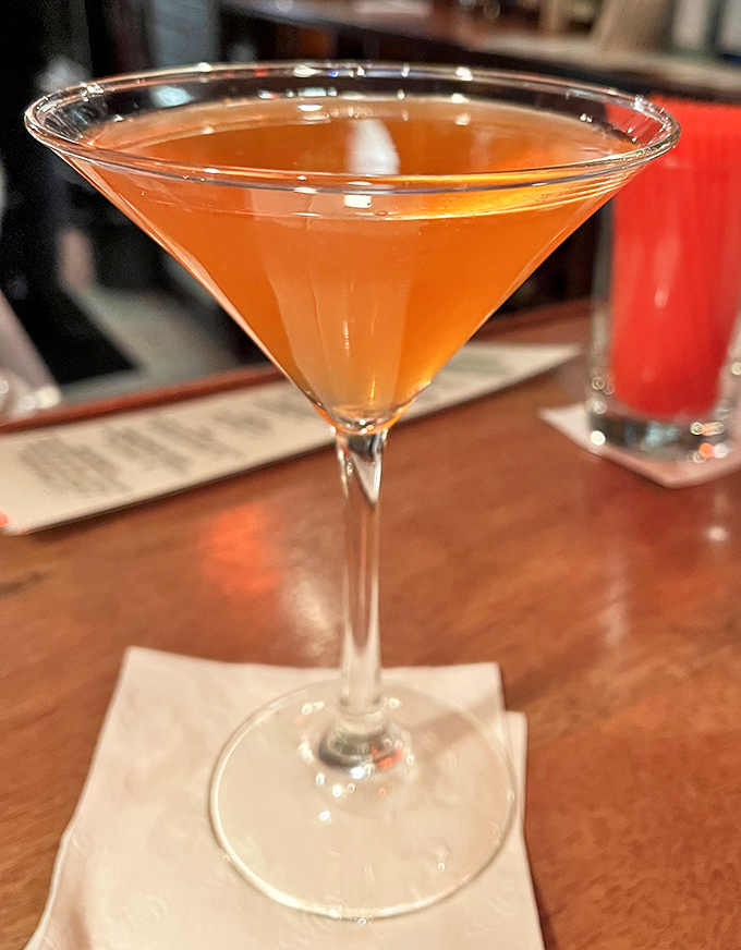 This amber-hued martini isn't just a cocktail—it's liquid architecture with a twist. The kind of drink that makes mundane conversations suddenly fascinating.