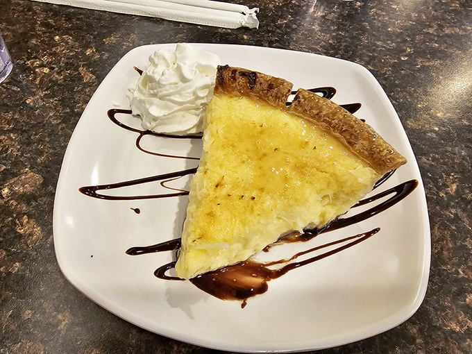 Coconut custard pie with chocolate drizzle &ndash; proof that sometimes the simplest desserts are the most transcendent.